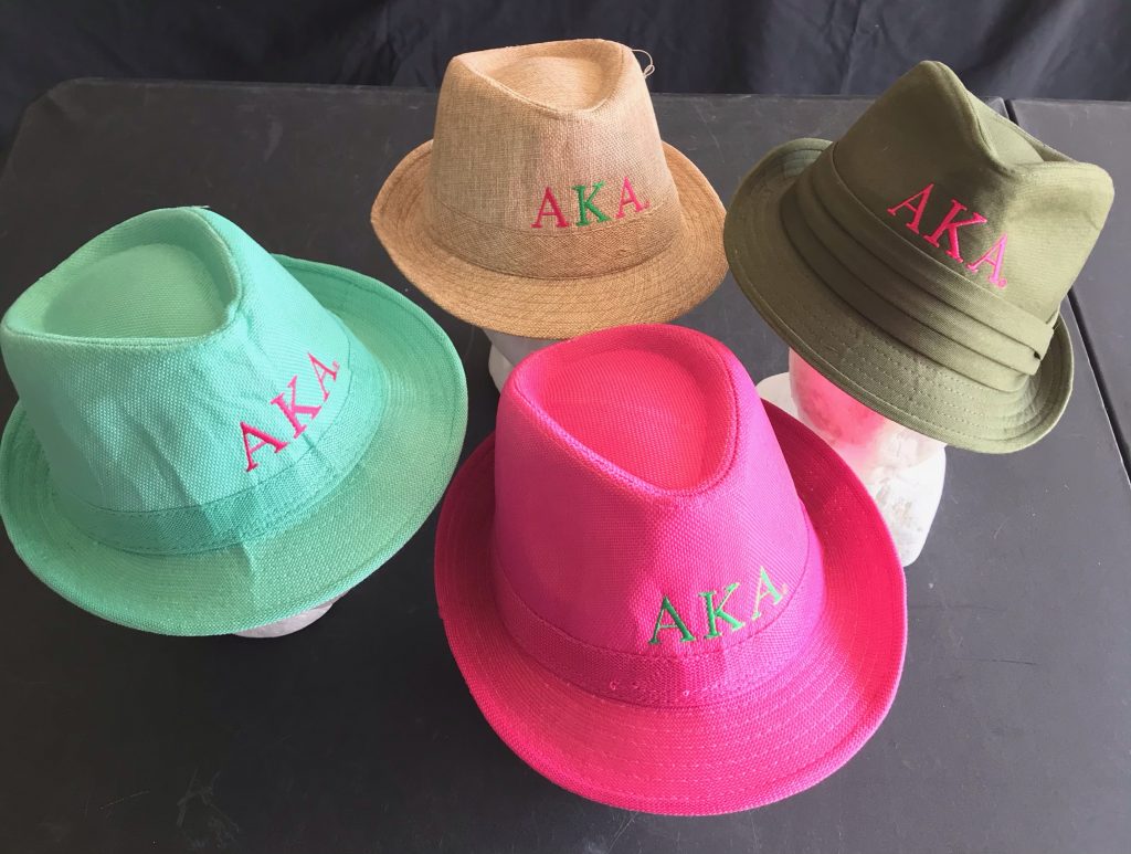 Ladie’s Assorted AKA Hats – Xpress Yourself Sportswear