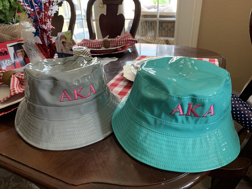 Ladie’s Assorted AKA Hats – Xpress Yourself Sportswear